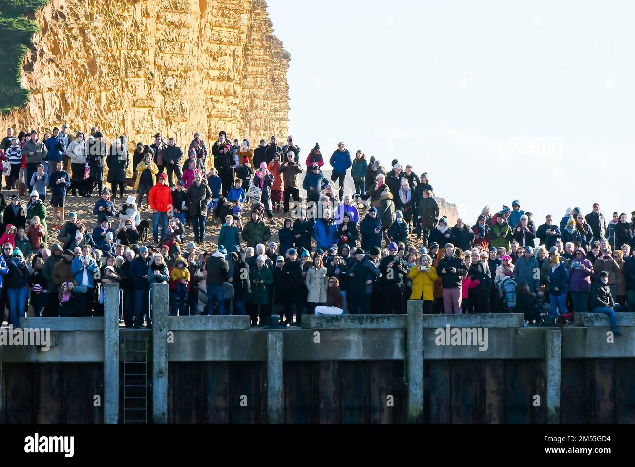 West Bay, Dorset, UK. 26th December 2022. UK Weather. A large crowd ...