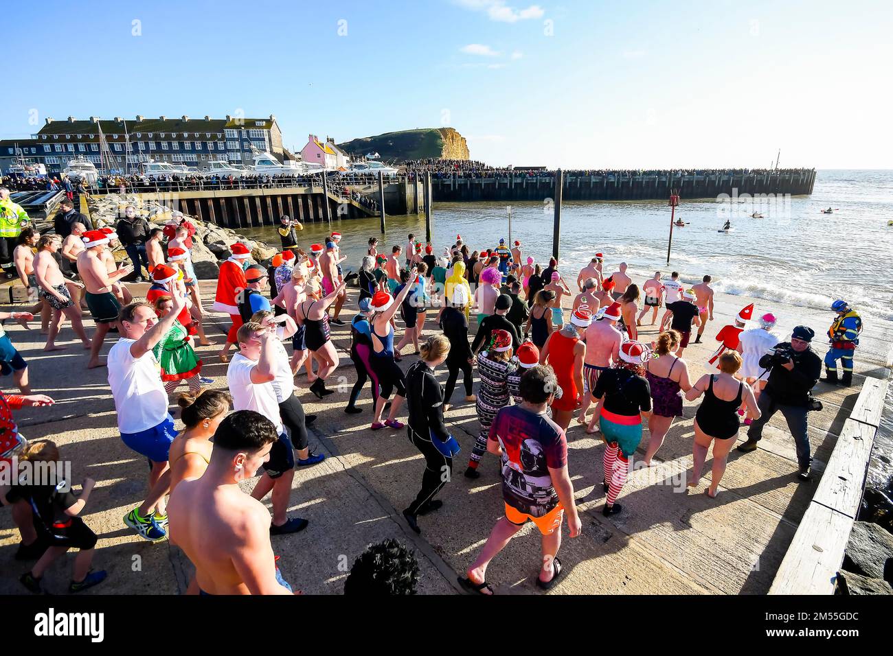 West Bay, Dorset, UK. 26th December 2022. UK Weather. Brave Boxing Day ...