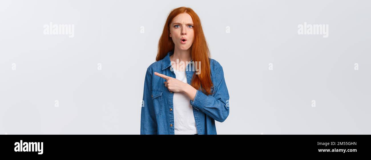 What is that. Displeased, tensed and mad frustrated redhead bossy woman ...