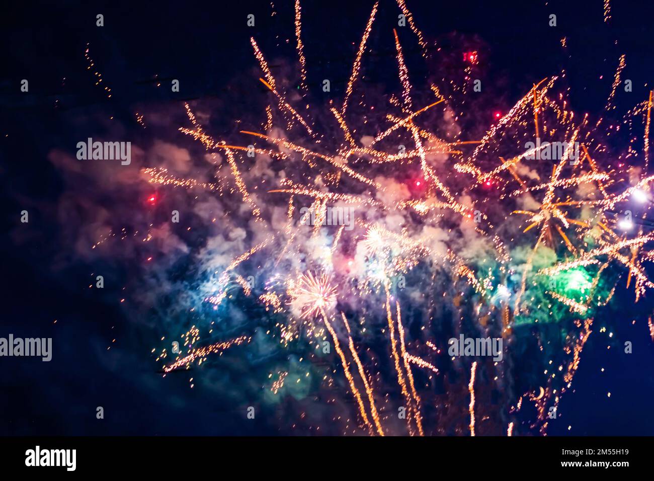 Beautiful multi-colored fireworks against the background of the night ...