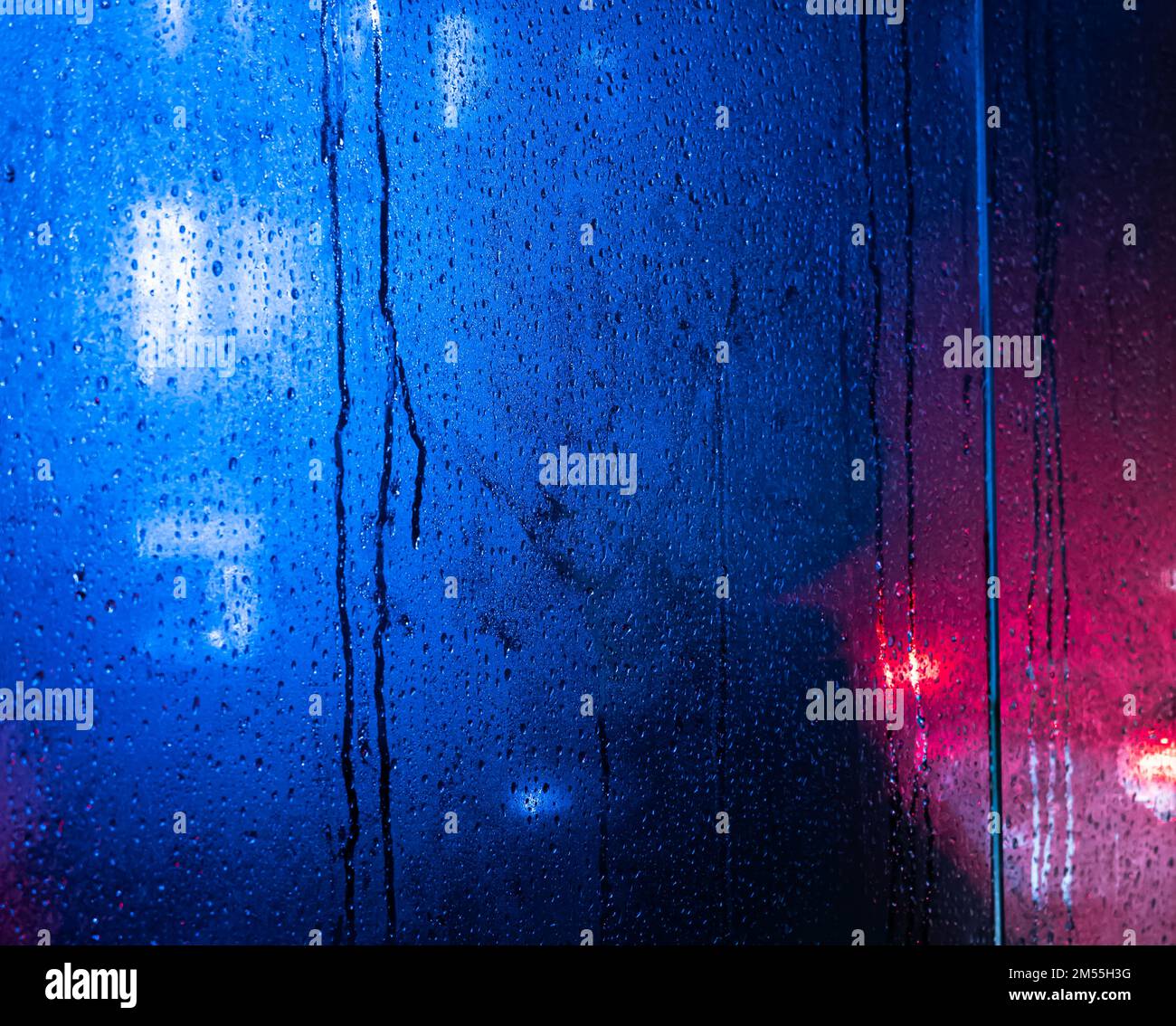 Blackout in Kyiv. Glass showcases with drops of rain and sleet on the ...