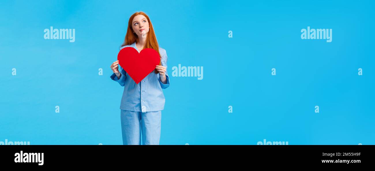 Dreamy and creative, redhead caucasian girl thinking what her future ...