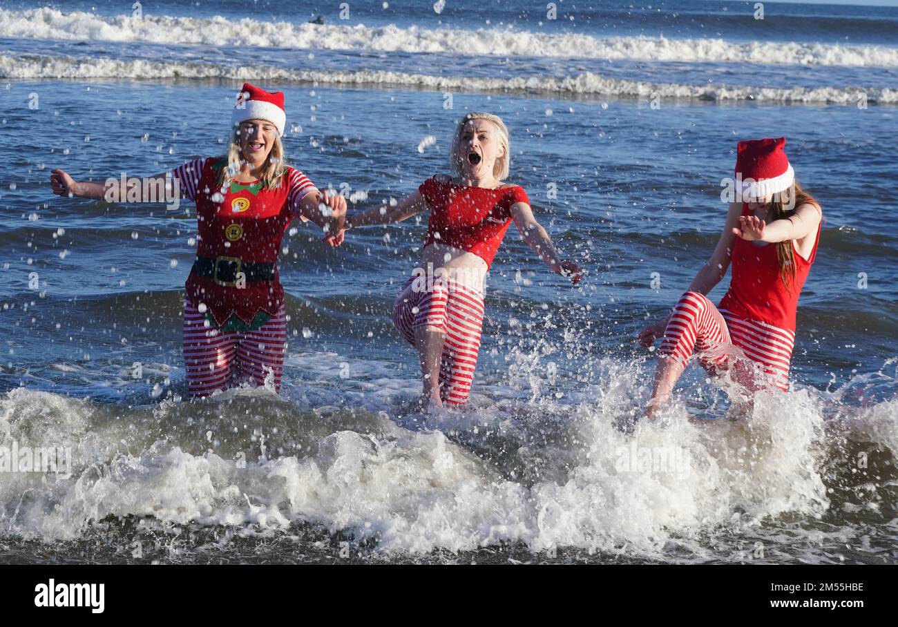 Bathers take part on the annual Boxing Day Swim at Tynemouth Longsands ...