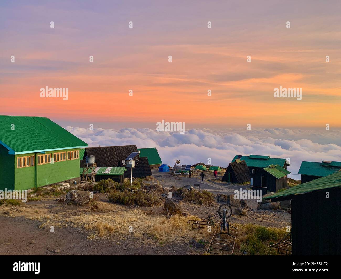 The Horombo Huts on Mount Kilimanjaro with a sea of fluffy clouds ...