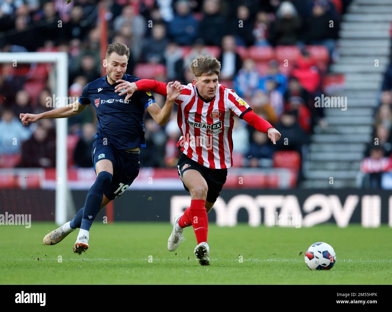 Blackburn Rovers' Ryan Hedges (left) and Sunderland's Dennis Cirkin ...