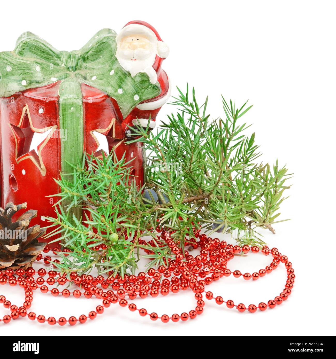 New Year's decor: beads, cones, candlestick isolated on a white ...