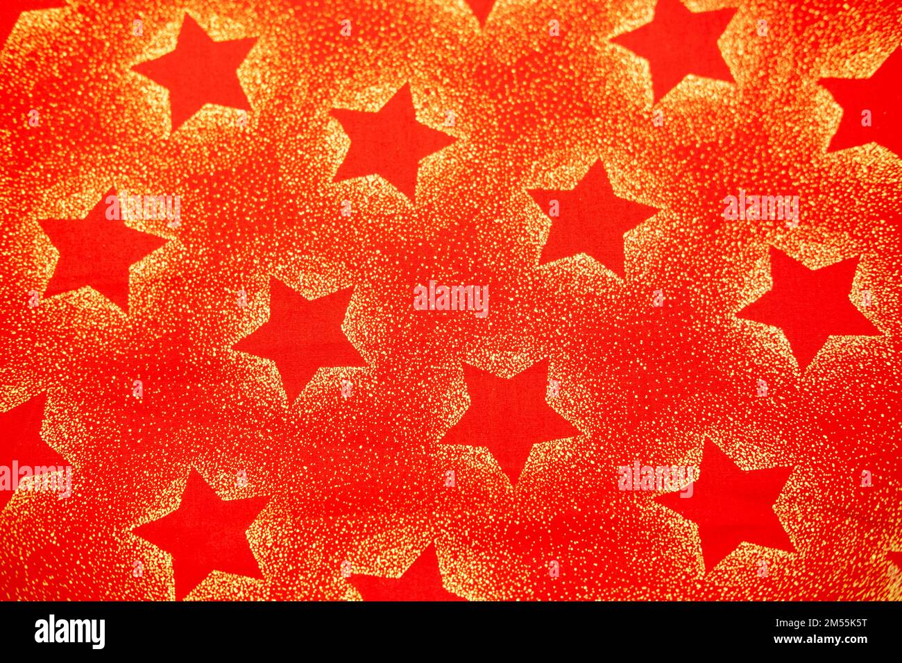 Red background with stars with sequins. christmas background fabric ...