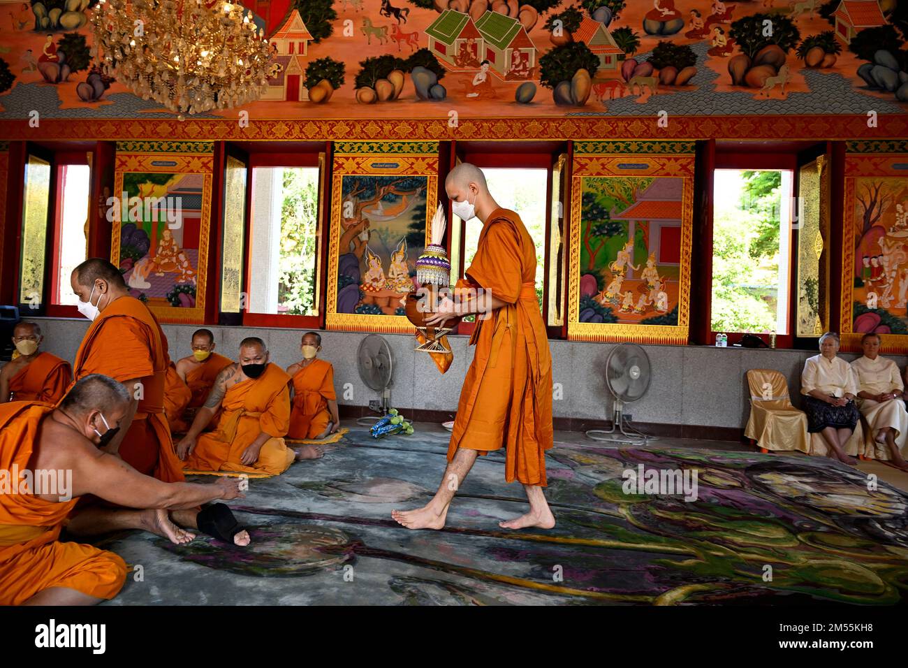 William Bicknell, wearing a mask, after being ordained leaves the ...