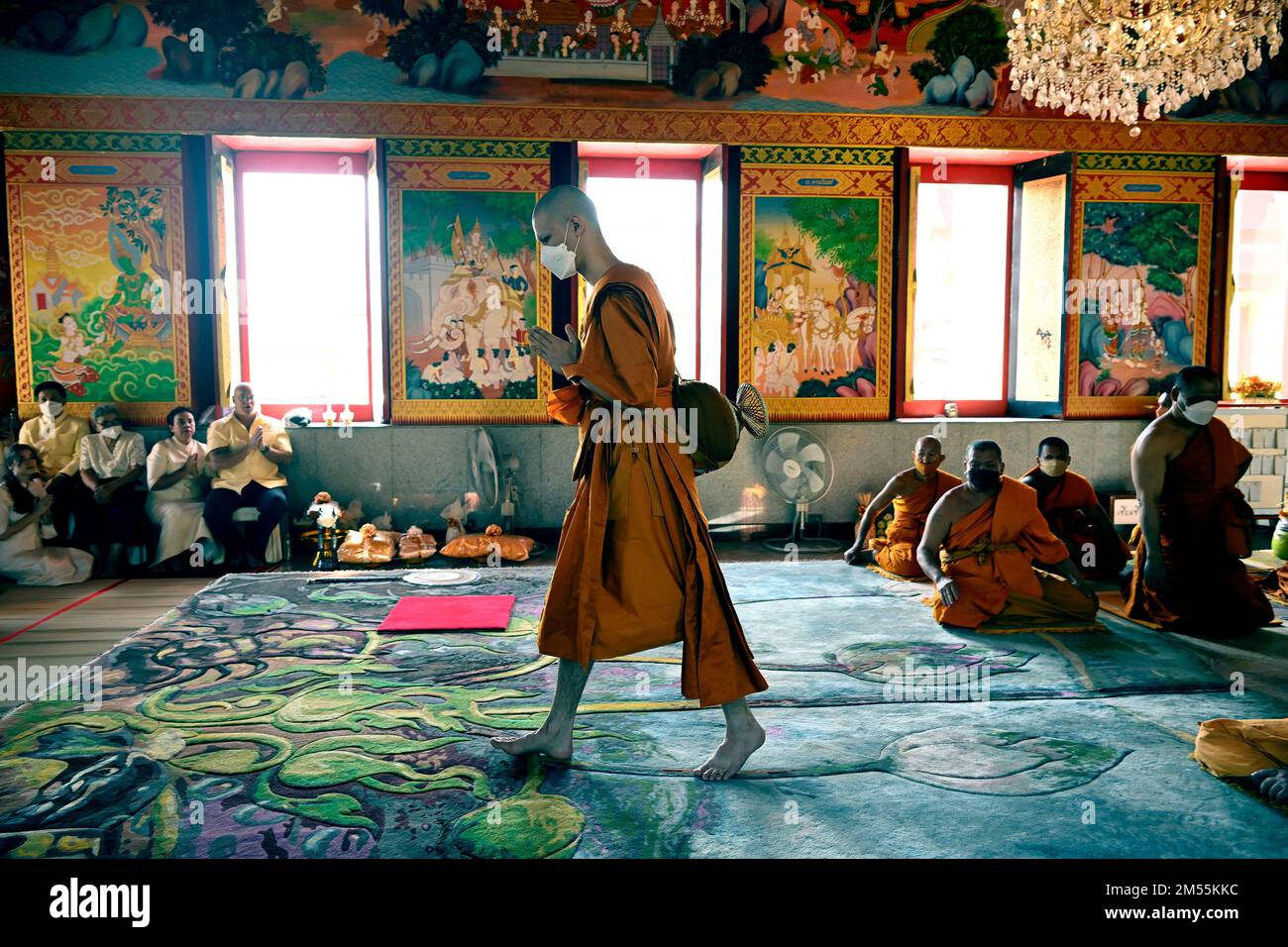 William Bicknell, wearing a mask, after being ordained leaves the ...