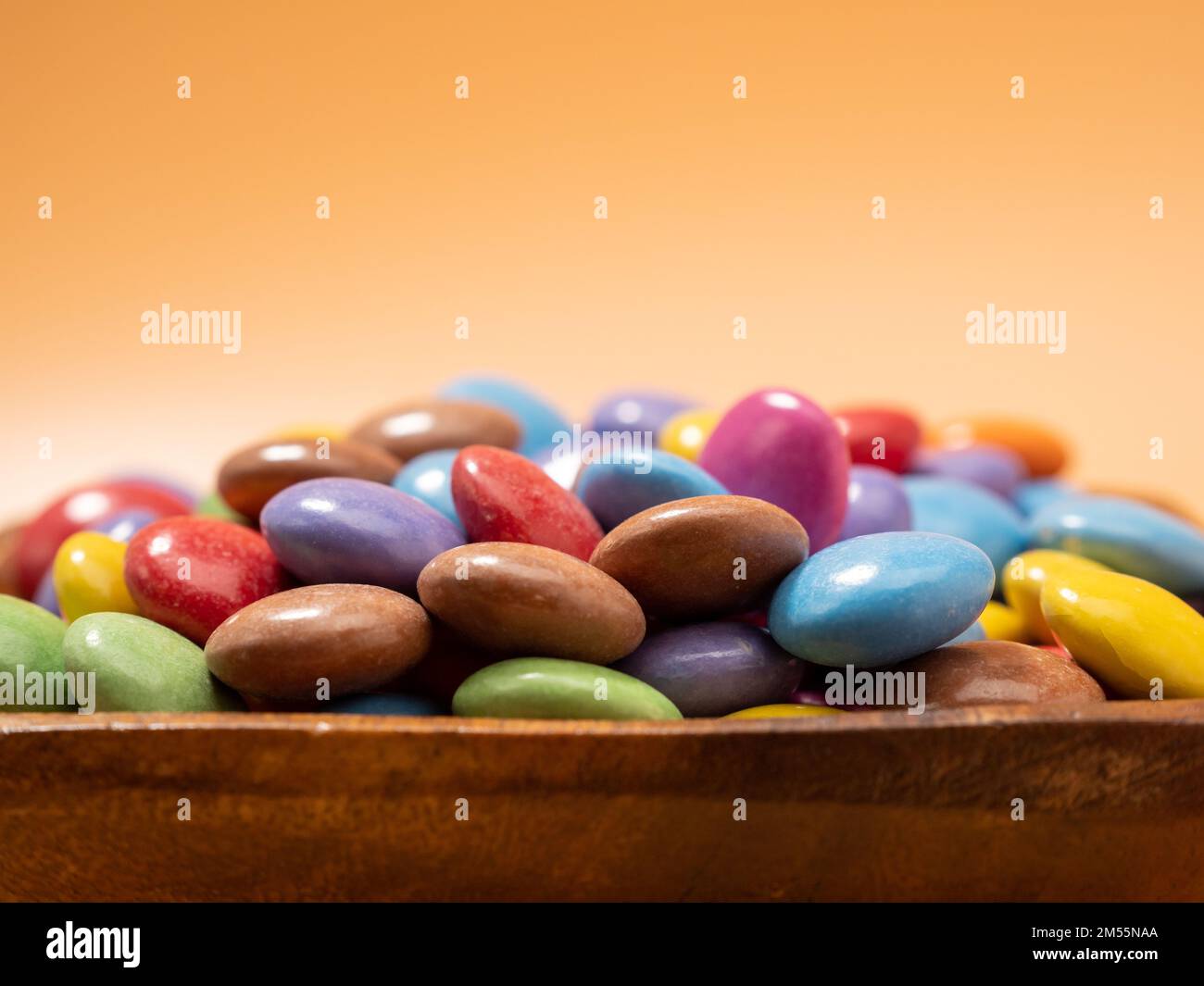 Small multi-colored round candies. Sweets covered with sugar icing ...