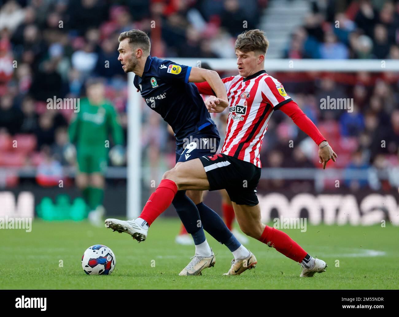Blackburn Rovers' Ryan Hedges (left) and Sunderland's Dennis Cirkin ...