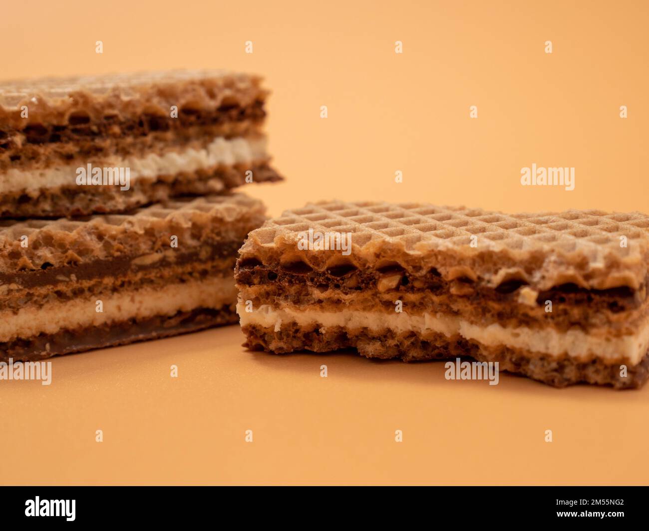 Crispy waffles with cocoa cream and nuts. Wafers with chocolate and ...