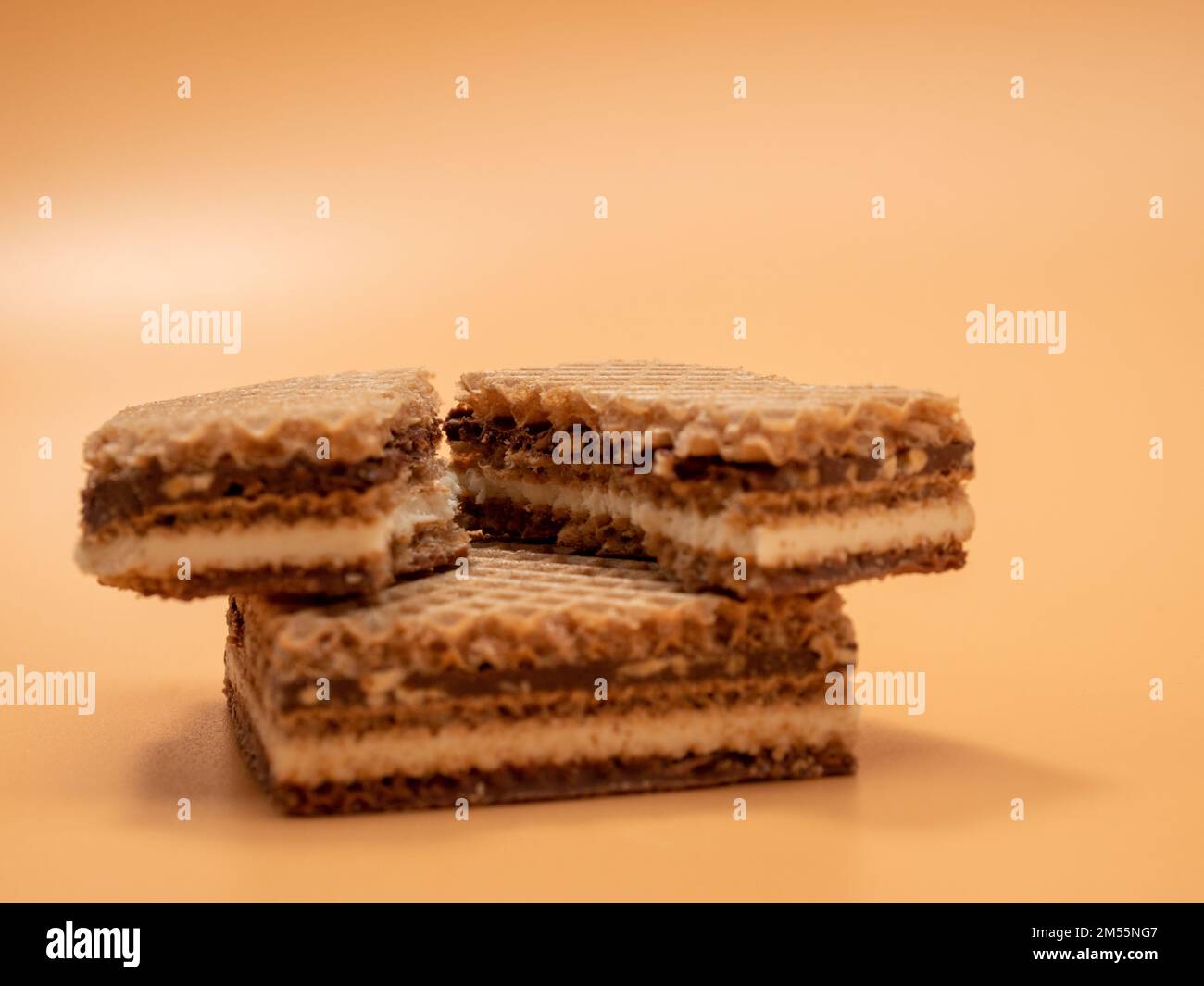 Crispy waffles with cocoa cream and nuts. Wafers with chocolate and ...