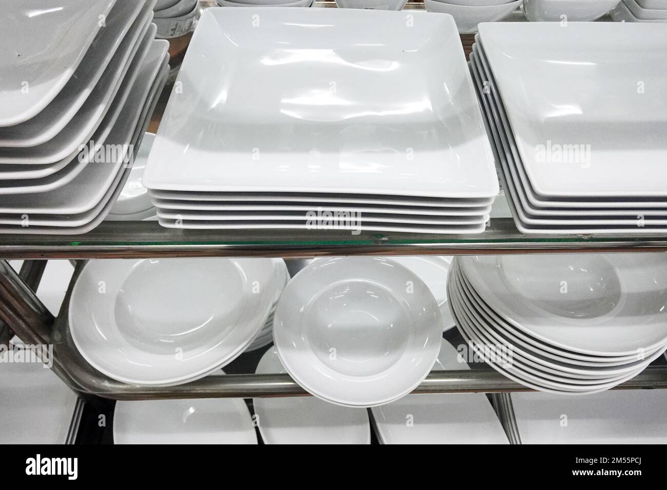 Stacked plates in a shop Stock Photo - Alamy