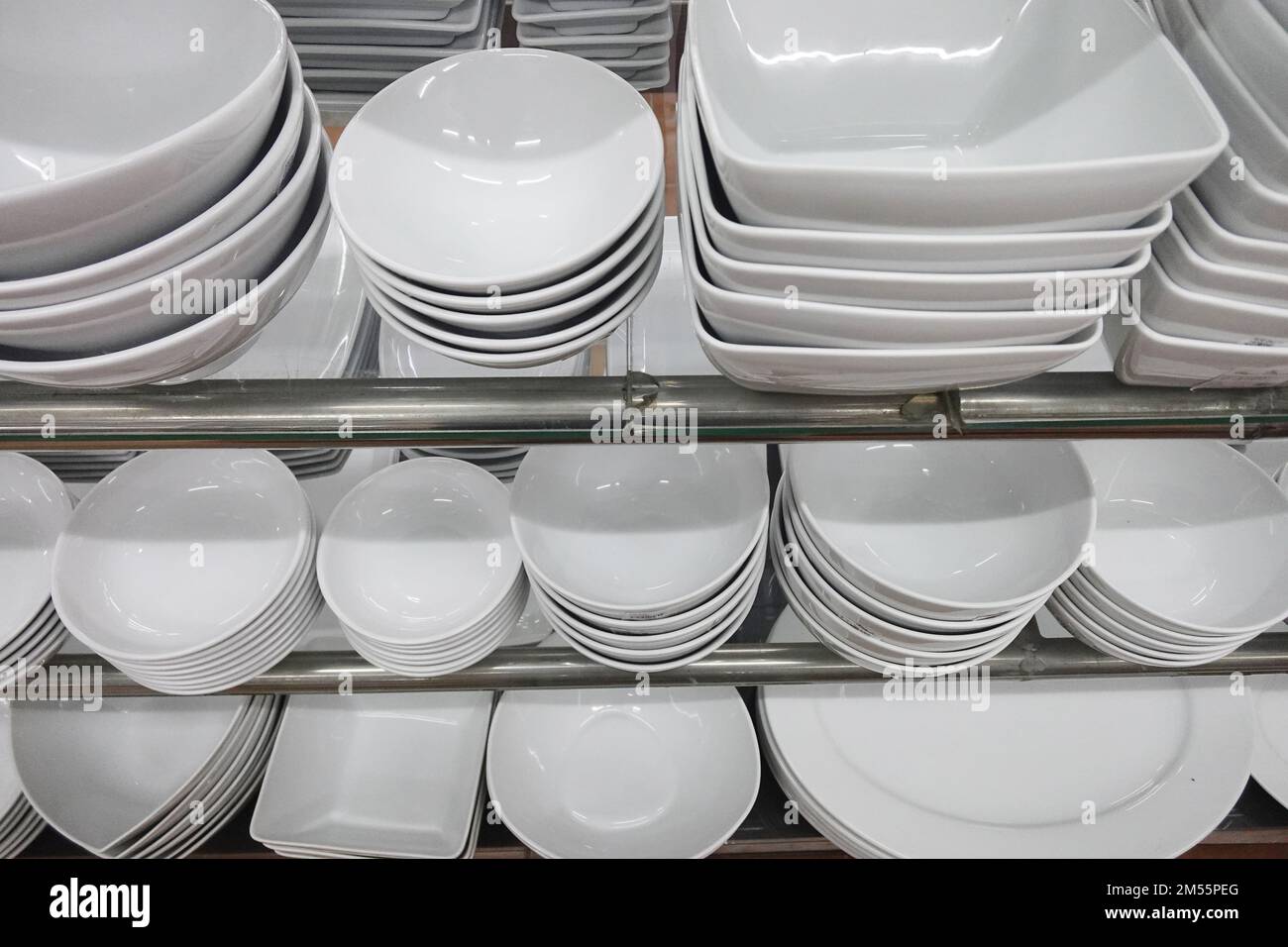 Stacked plates in a shop Stock Photo - Alamy