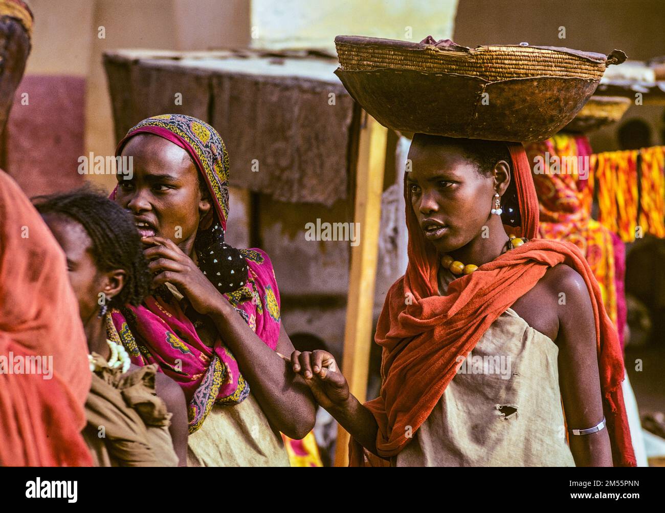 Ethiopia, 1970s, Harar, market, 2 young women, one carrying baskets on ...