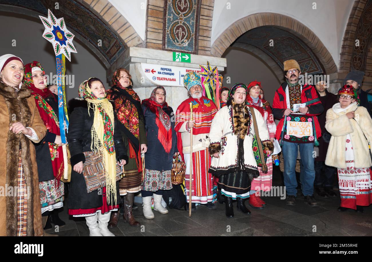 Residents in Ukrainian folklore costumes sing carols, and hold ...