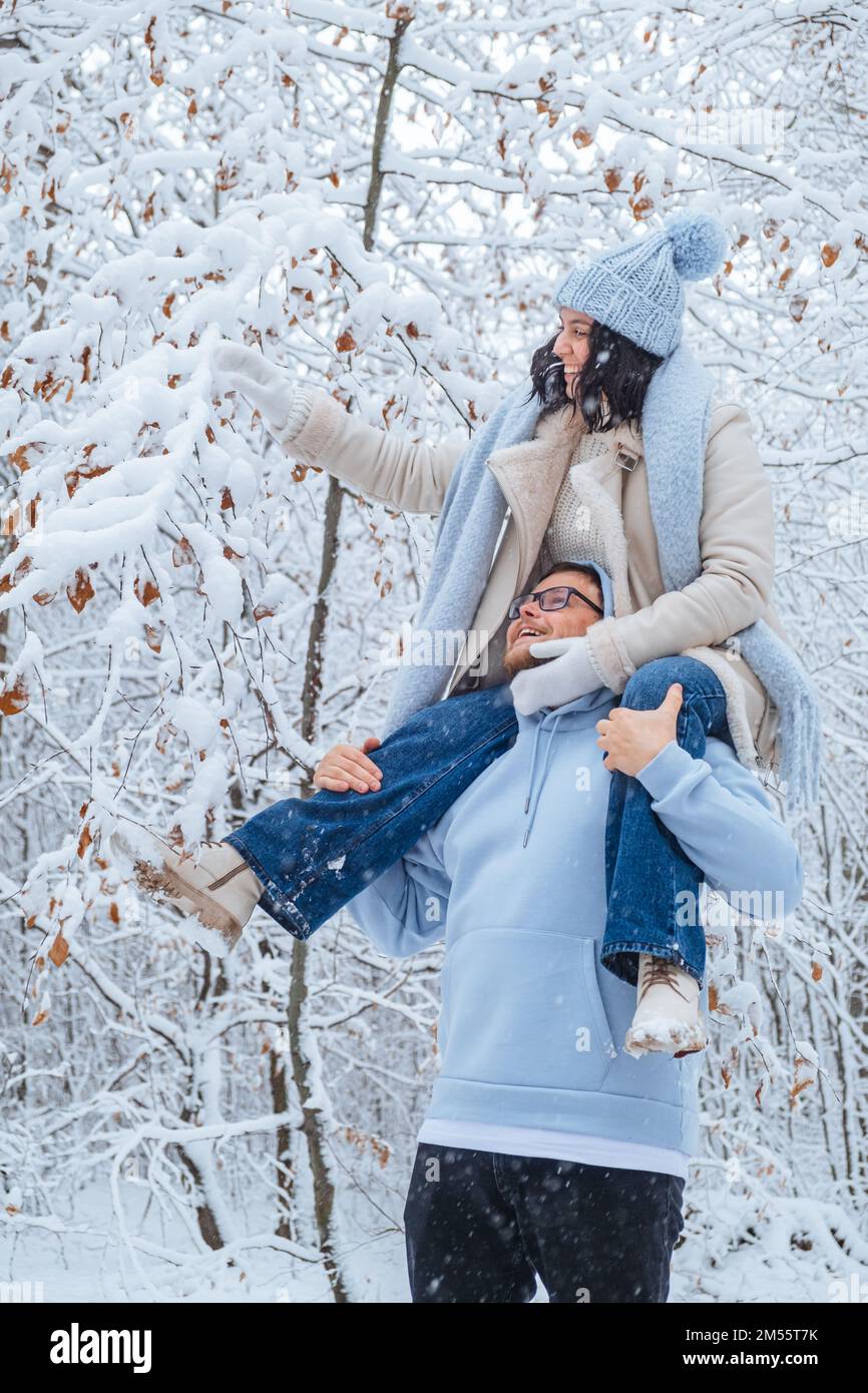 woman is piggybacking on man in forest Stock Photo - Alamy