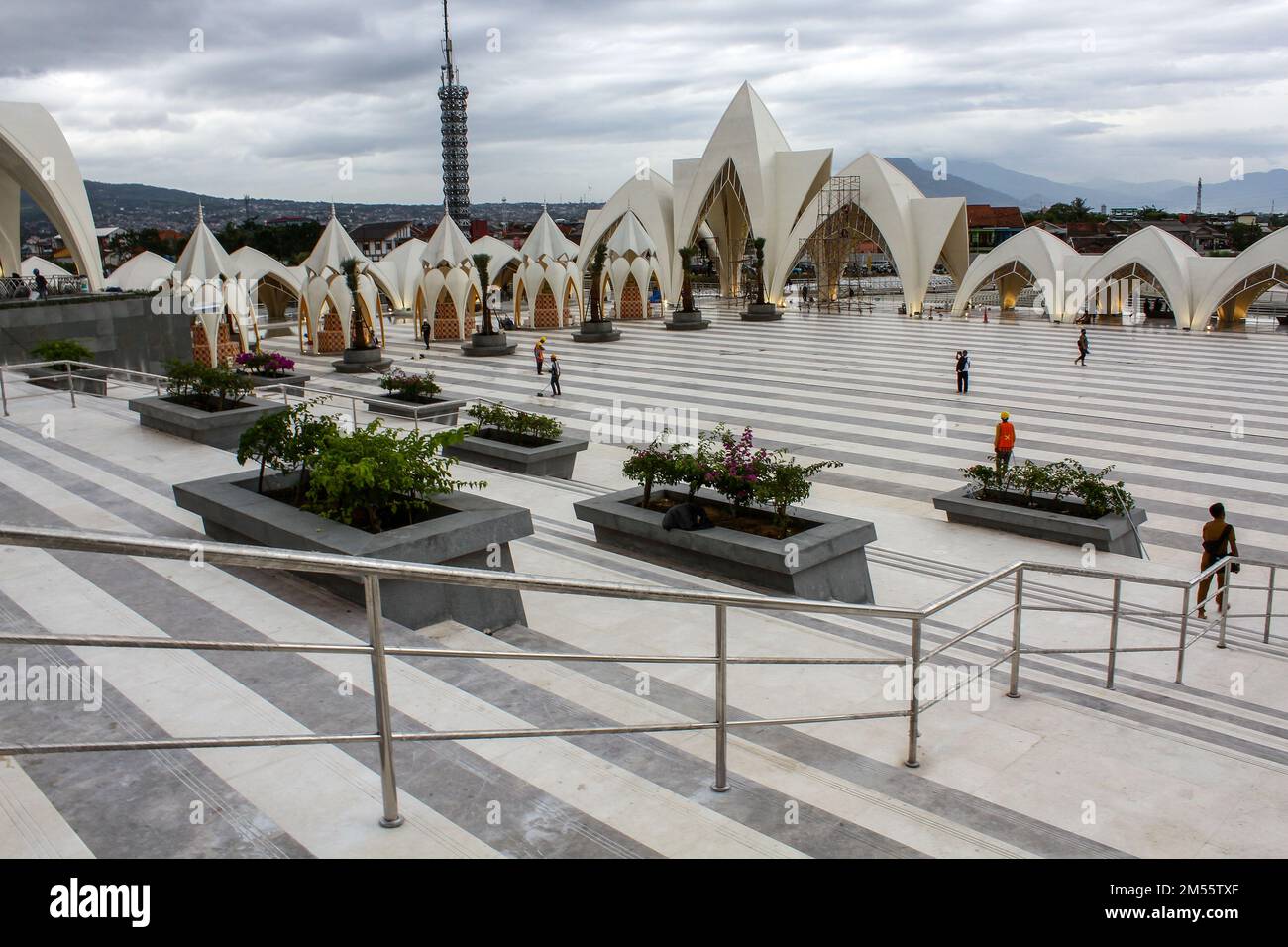 Workers clean the area in front of the Al-Jabbar Mosque in Bandung ...