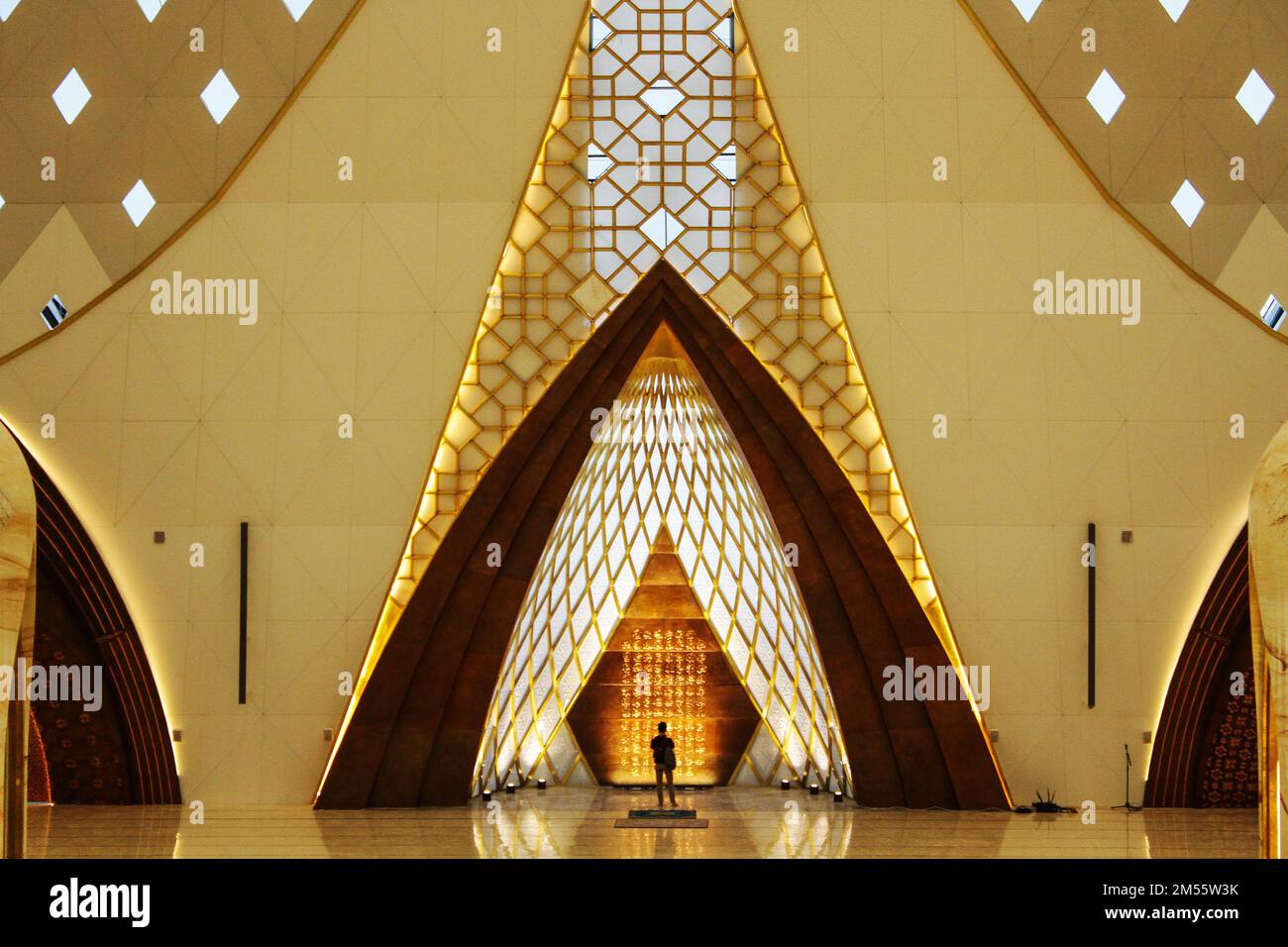 A journalist takes pictures inside of the Al-Jabbar Mosque during Media ...