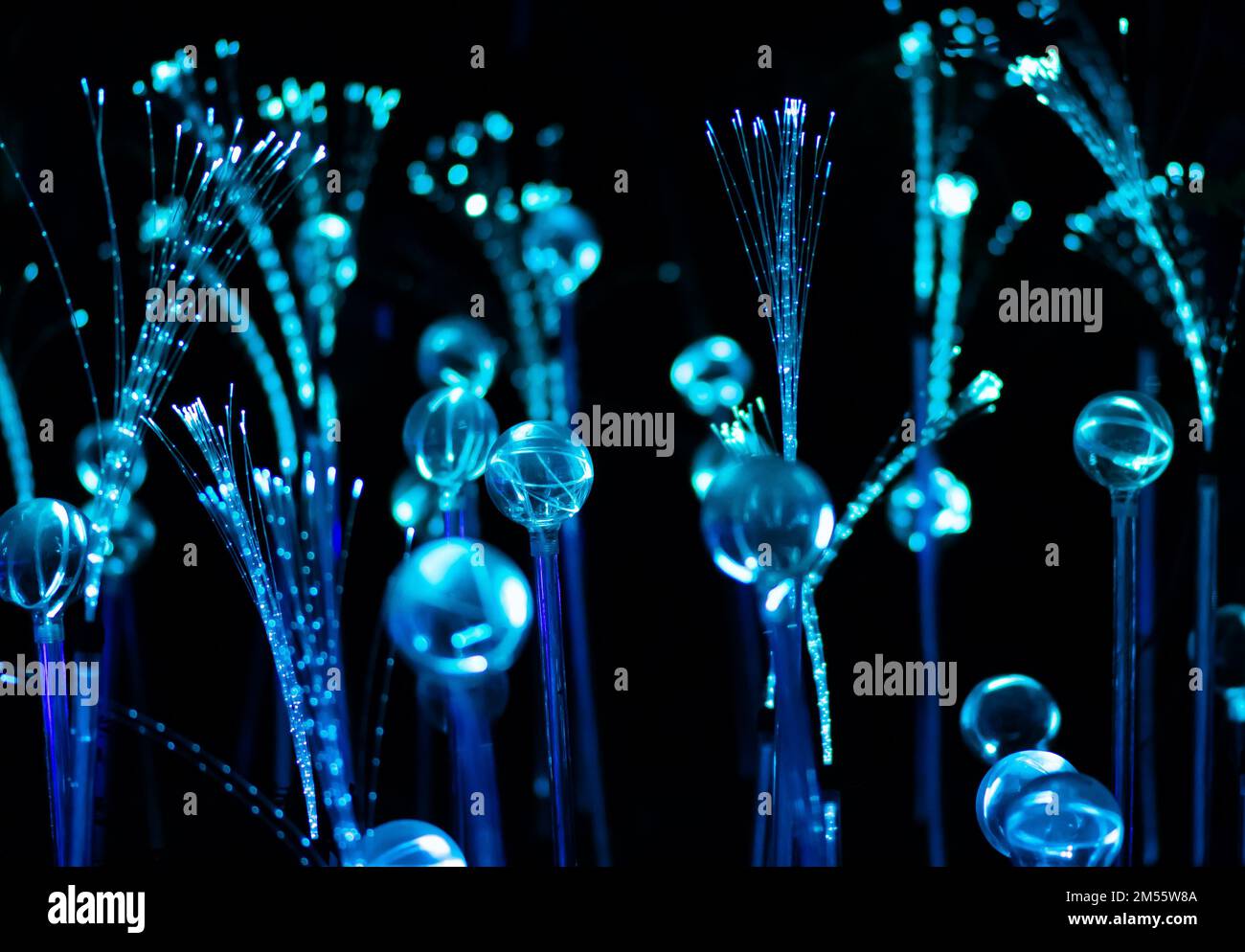 Blue fiber optic strands or filaments creating a magic fantastic ...