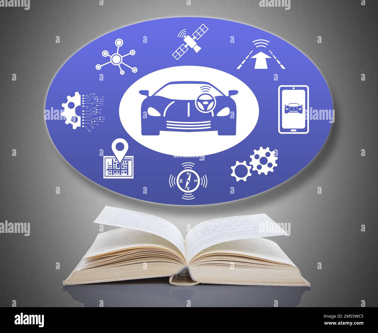 Driverless car concept above an open book Stock Photo - Alamy