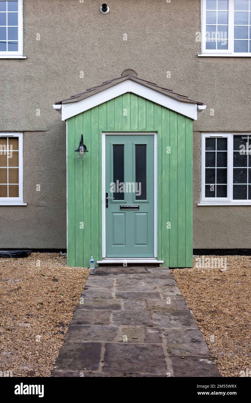 Green door on a new house Stock Photo - Alamy