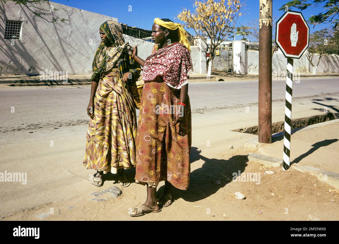 Ethiopia, 1970s, Dire Dawa, 2 Ethiopian women, local dresses, stop traffic sign, street, Dire ...