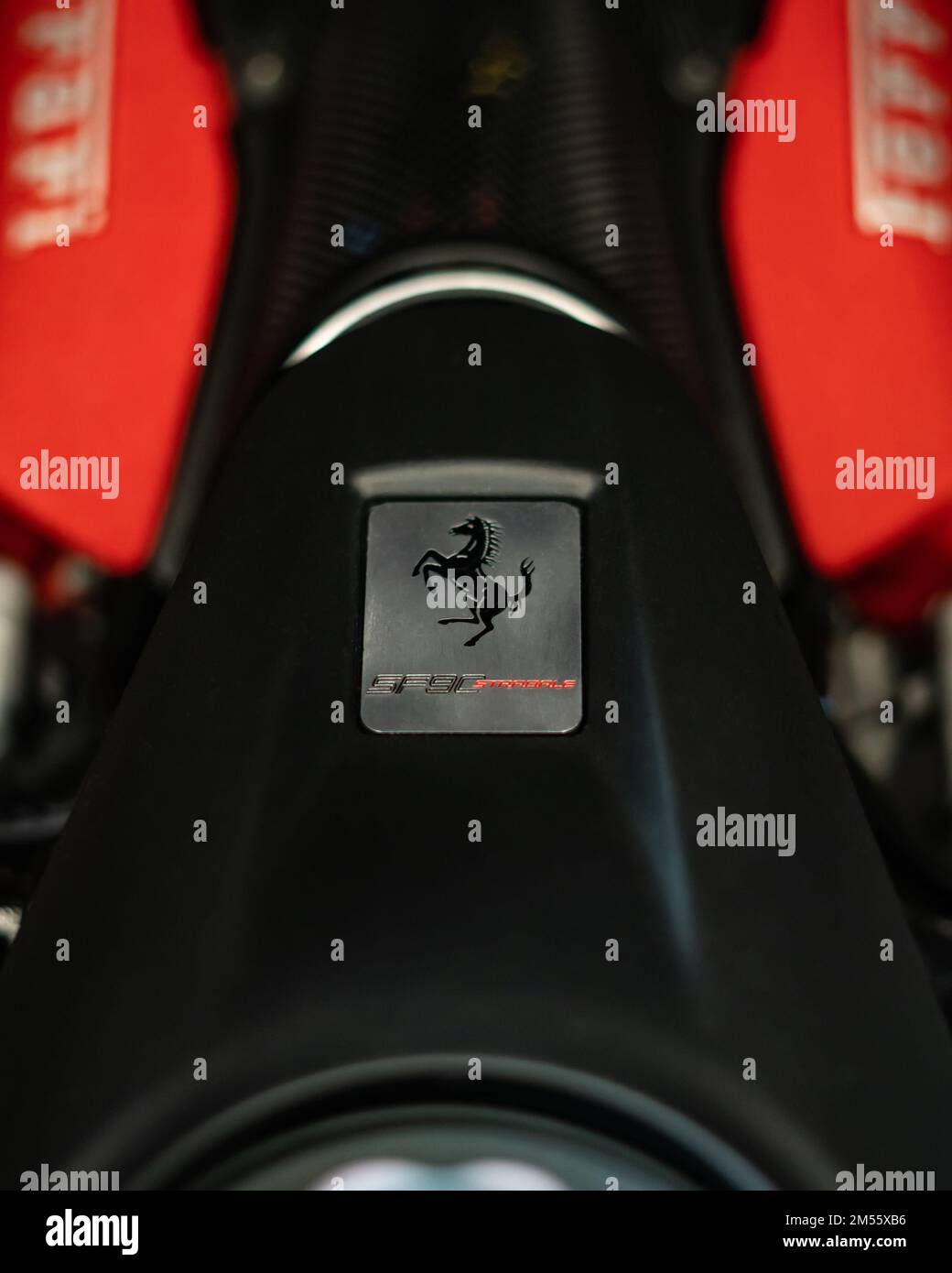 A selective vertical shot of the Ferrari SF-90 engine bay plaque with ...