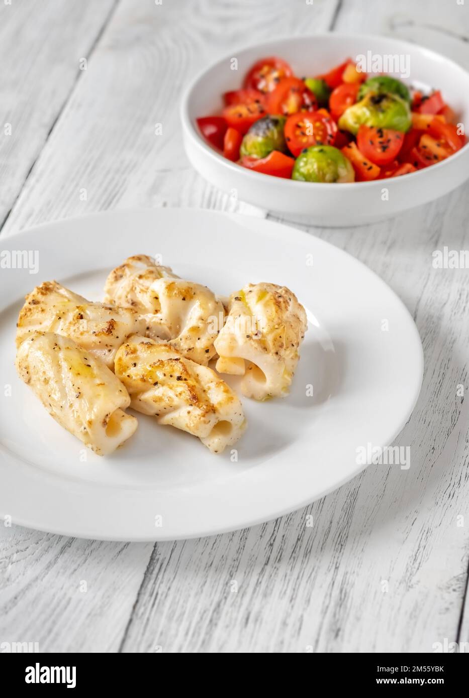 Portion of fried asian style calamari on the plate Stock Photo - Alamy