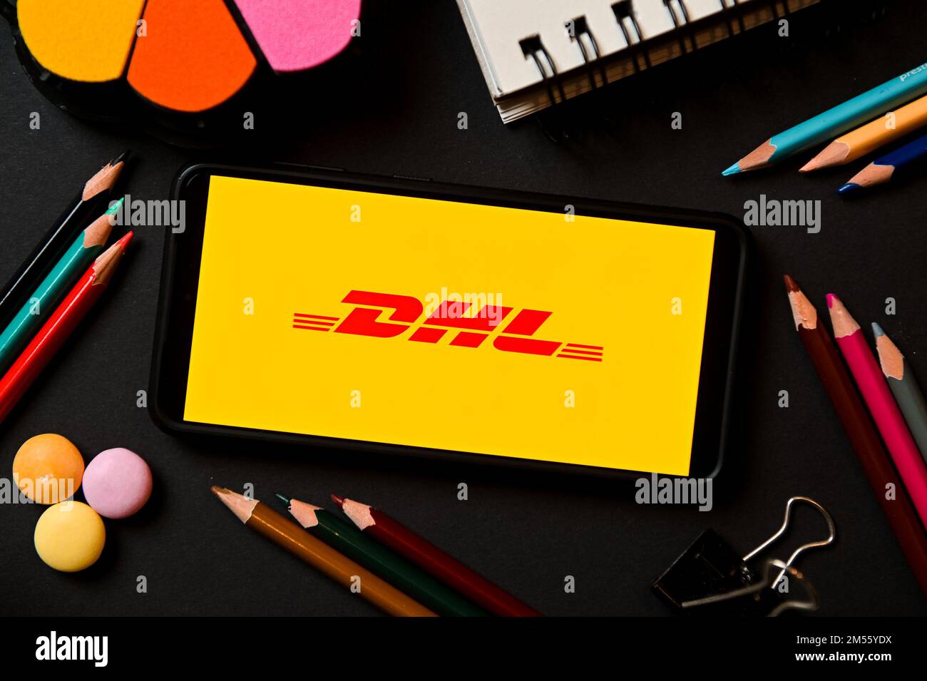 Poland. 17th Dec, 2022. In this photo illustration a DHL logo seen ...