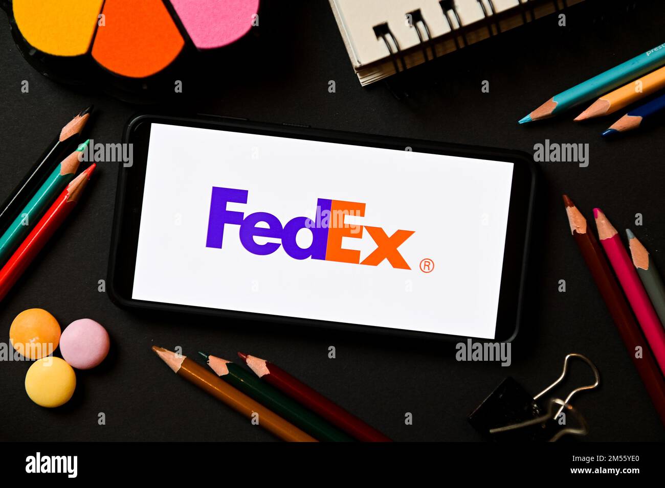 Poland. 17th Dec, 2022. In this photo illustration a FedEx logo seen ...