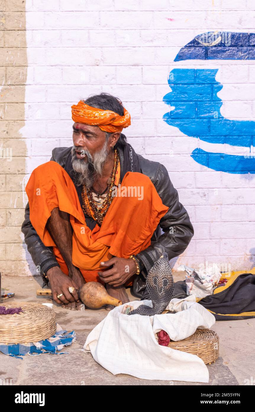Portrait of an unidentified old snake charmer male performing river ...