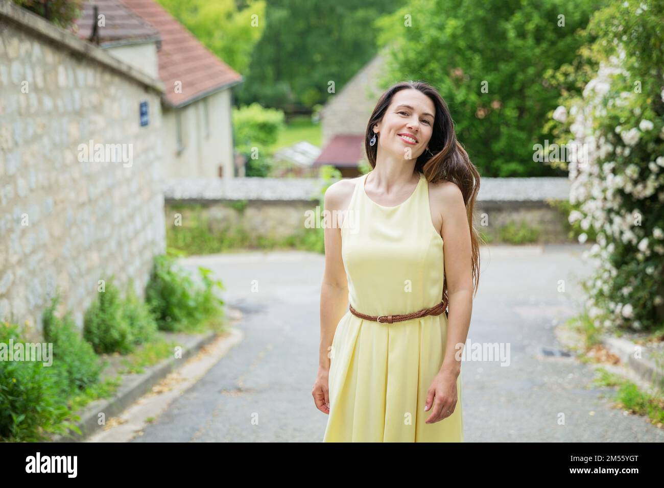 Lifestyle portrait of young stylish woman with long brunette hair Stock ...