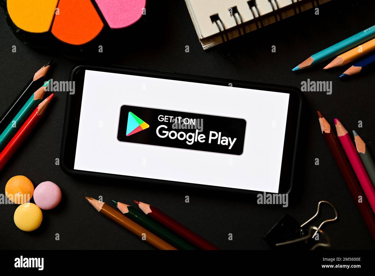 In this photo illustration a Google Play logo seen displayed on a smartphone. (Photo by Mateusz ...