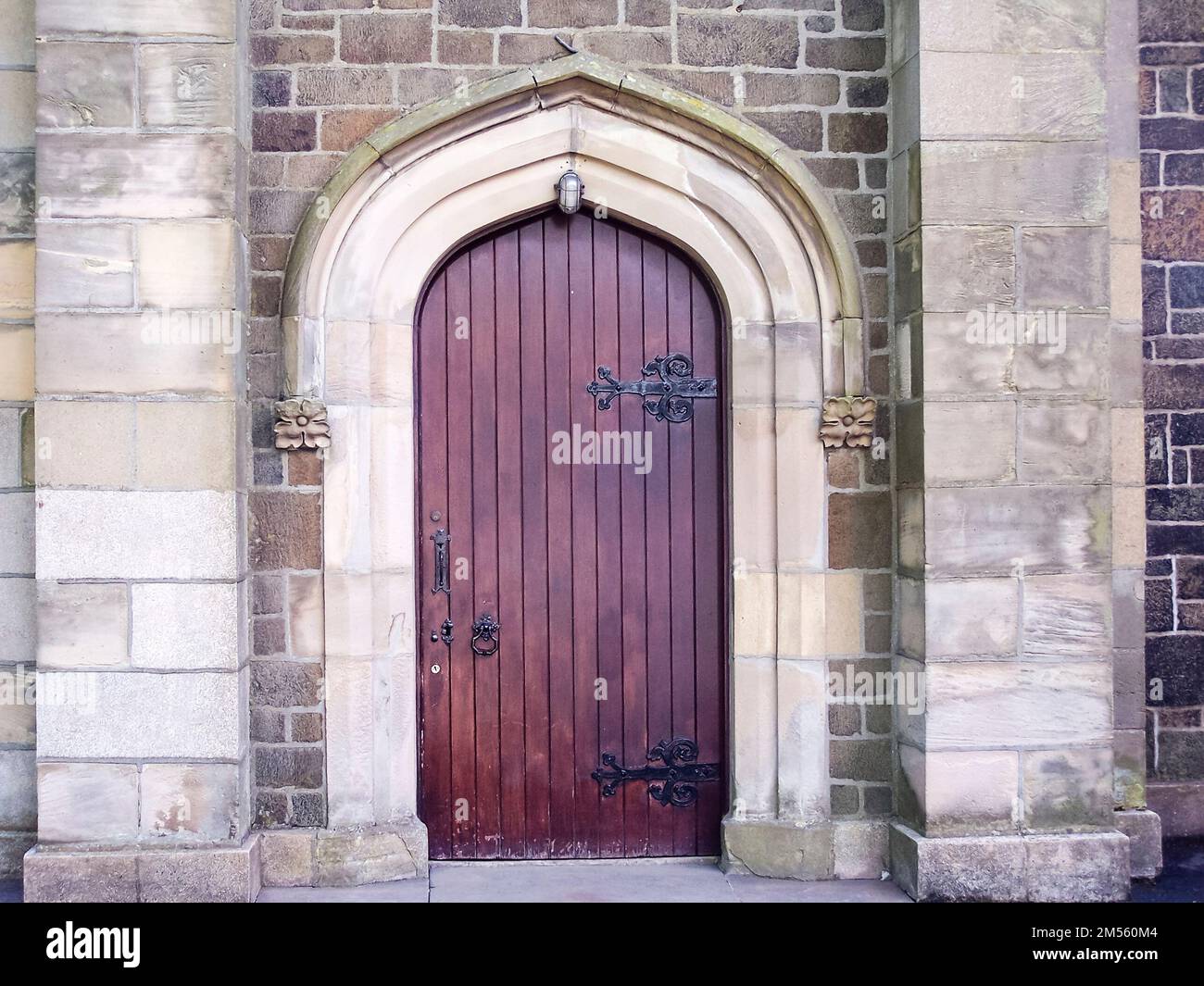 Wooden church door on a 19th century stone Irish church Stock Photo - Alamy