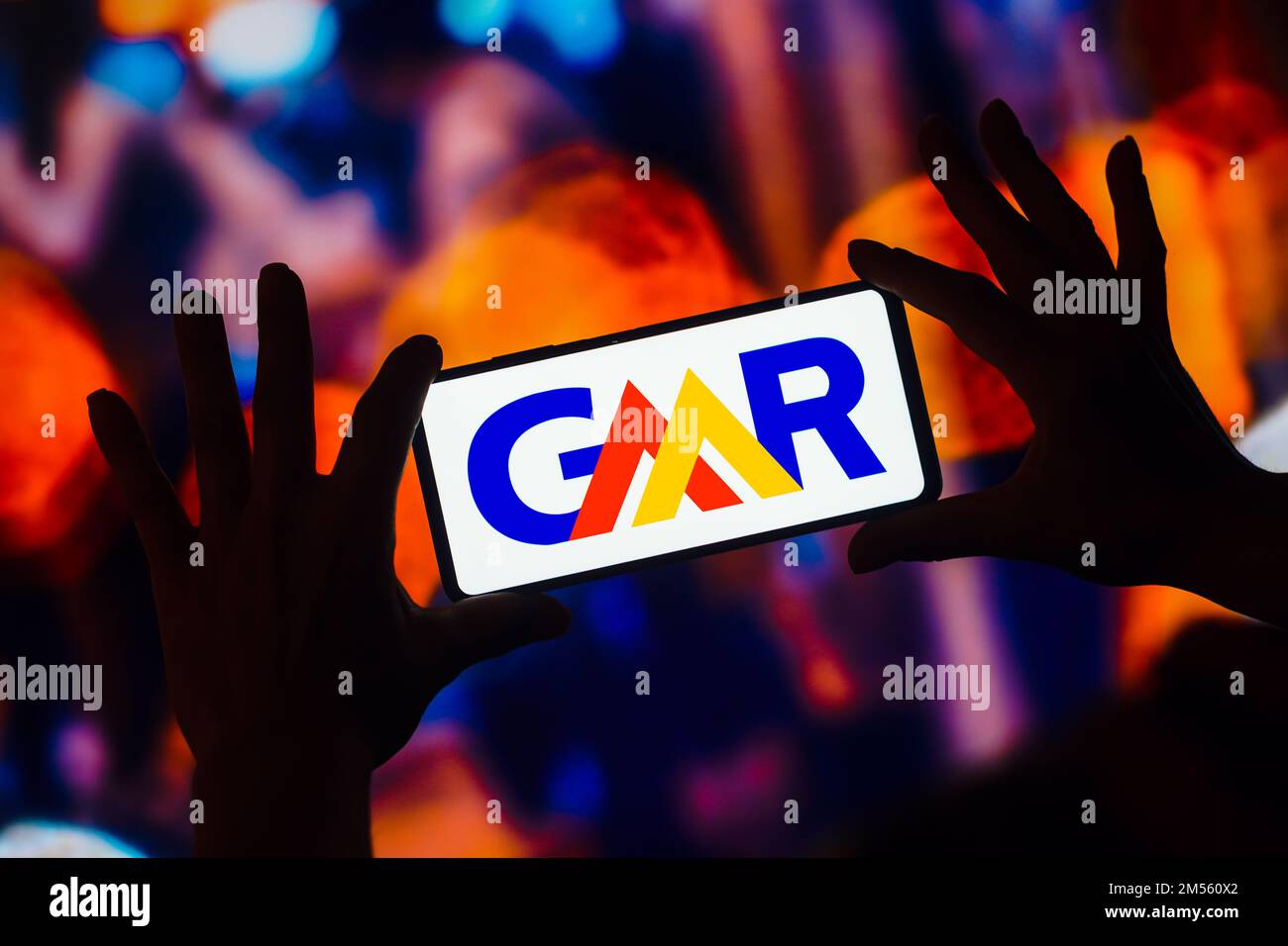 In this photo illustration, the GMR Group logo is displayed on a ...
