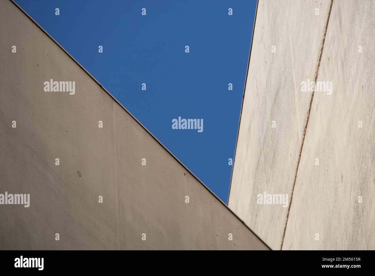 Modern architecture, concrete walls with blue sky - geometric shape ...