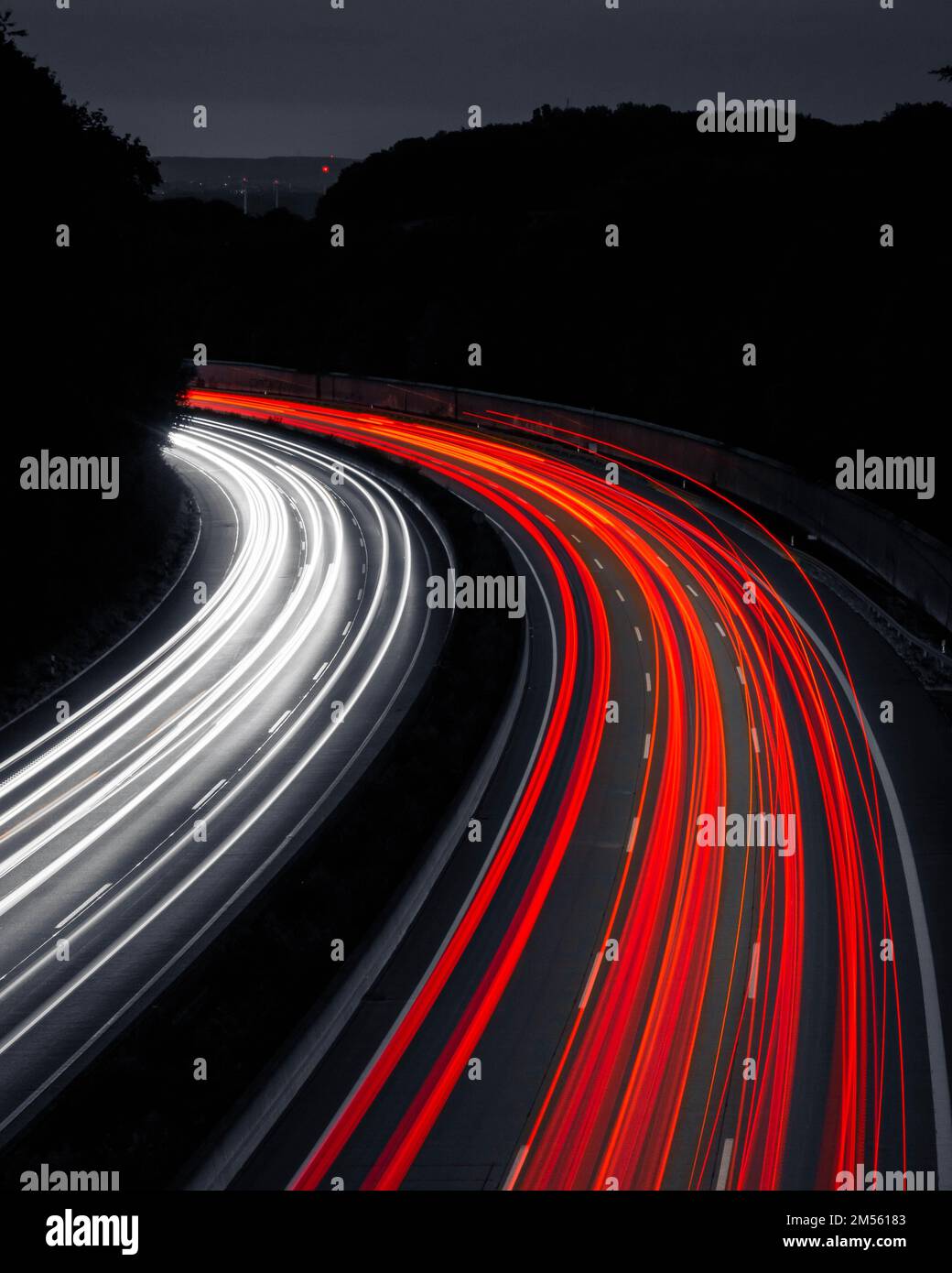 A vertical shot of a highway at night with long exposure lights Stock ...