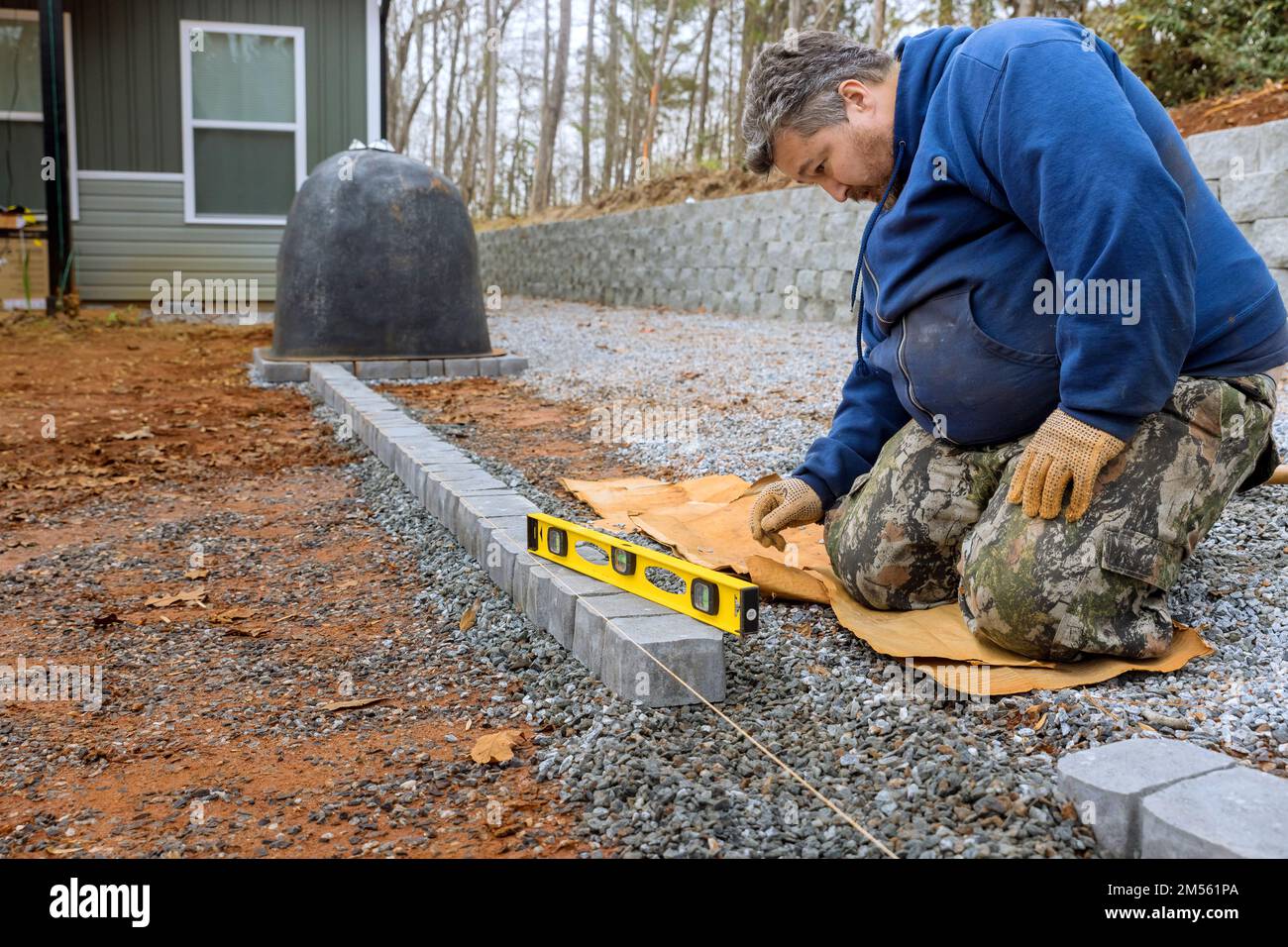 On construction site construction worker is installing precast concrete ...