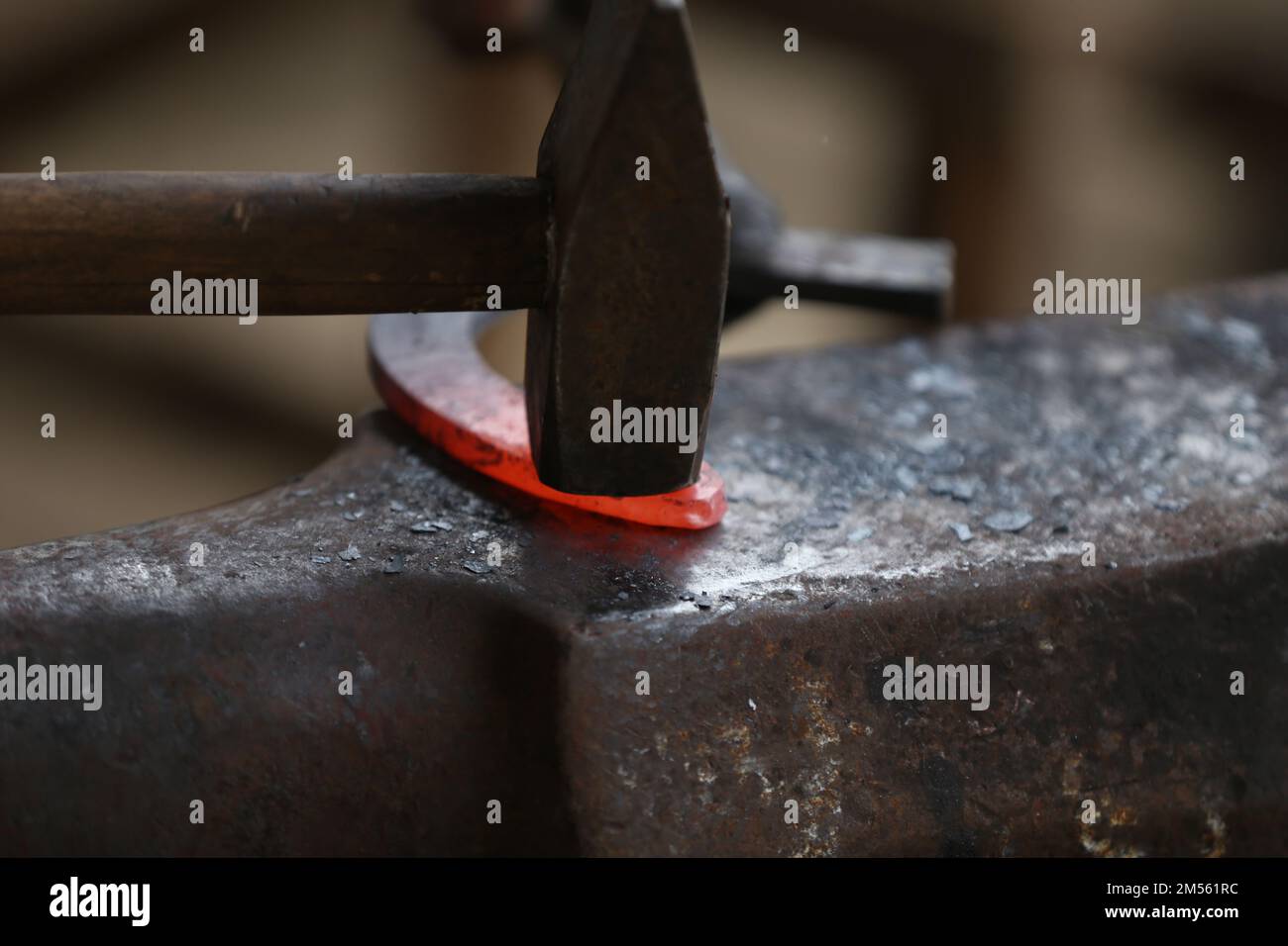 Smithy forging for hardening and heating iron. Blacksmith working at ...