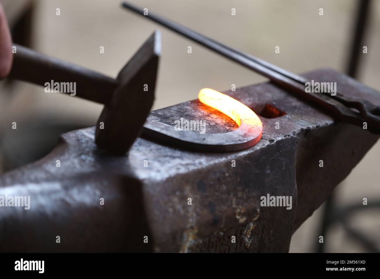 Smithy forging for hardening and heating iron. Blacksmith working at ...