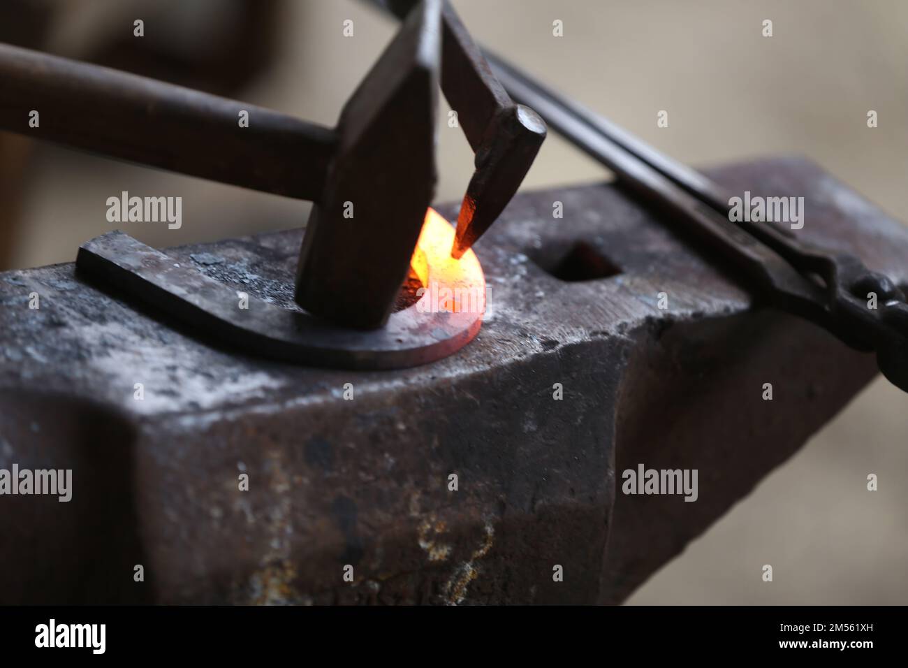 Smithy forging for hardening and heating iron. Blacksmith working at ...