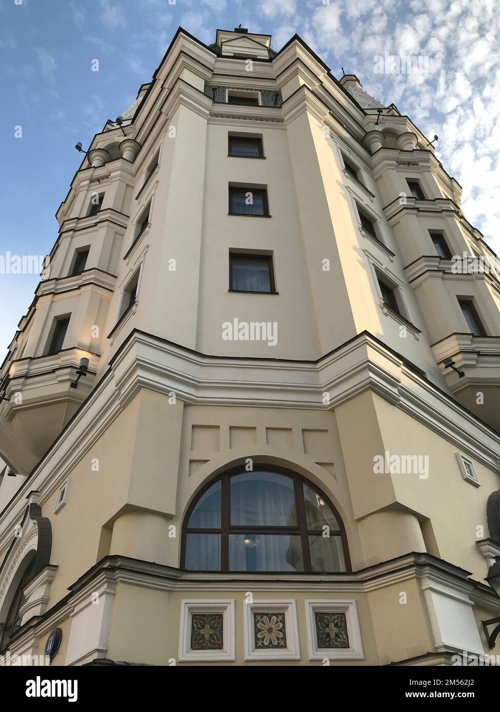 The facade of a high-rise corner building Stock Photo - Alamy