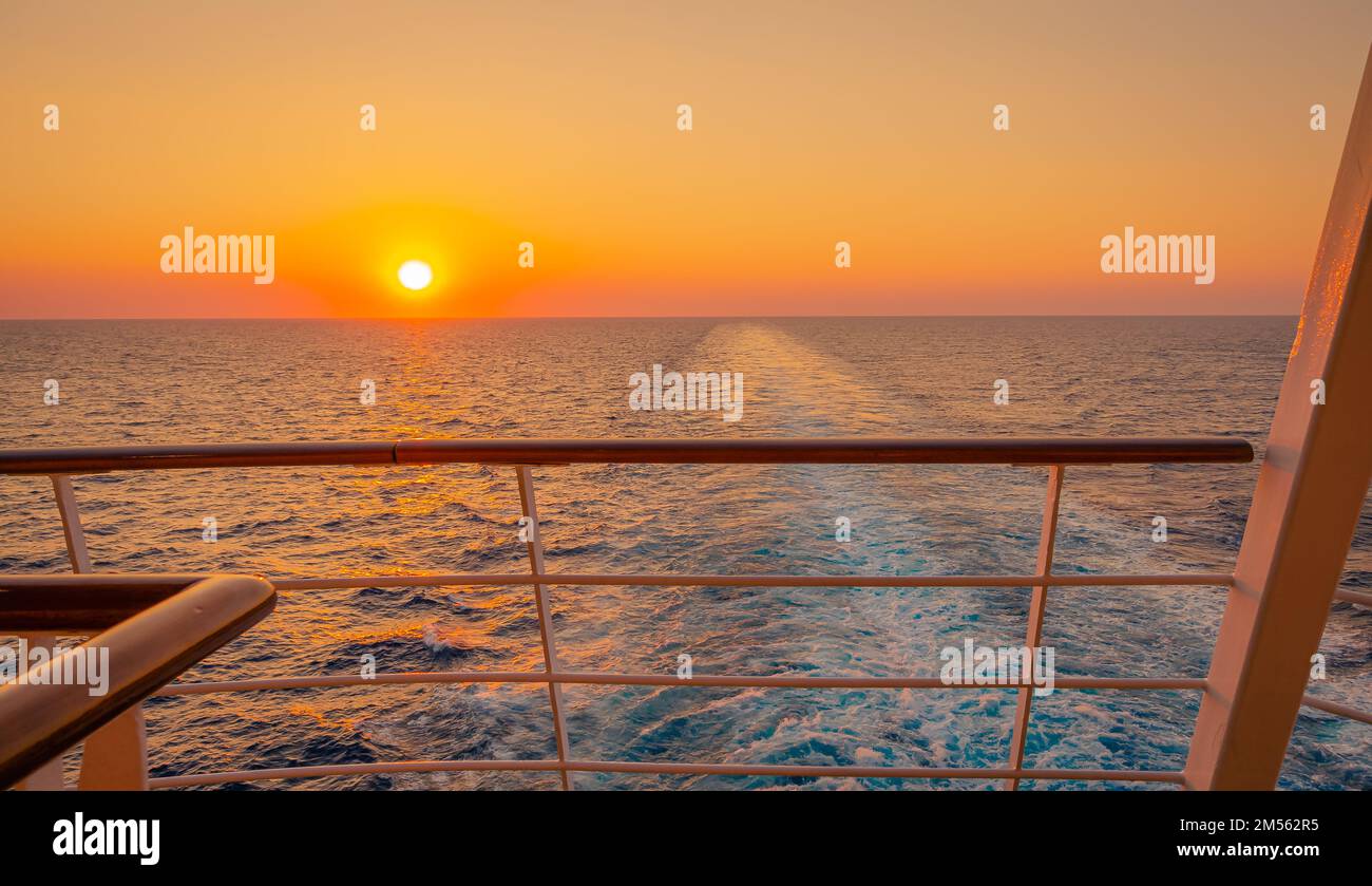 Promenade deck of a cruise ship in navigation with sunset Stock Photo ...