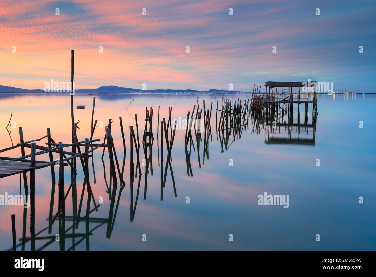 Amazing sunset on the palatial pier of Carrasqueira, Alentejo, Portugal ...
