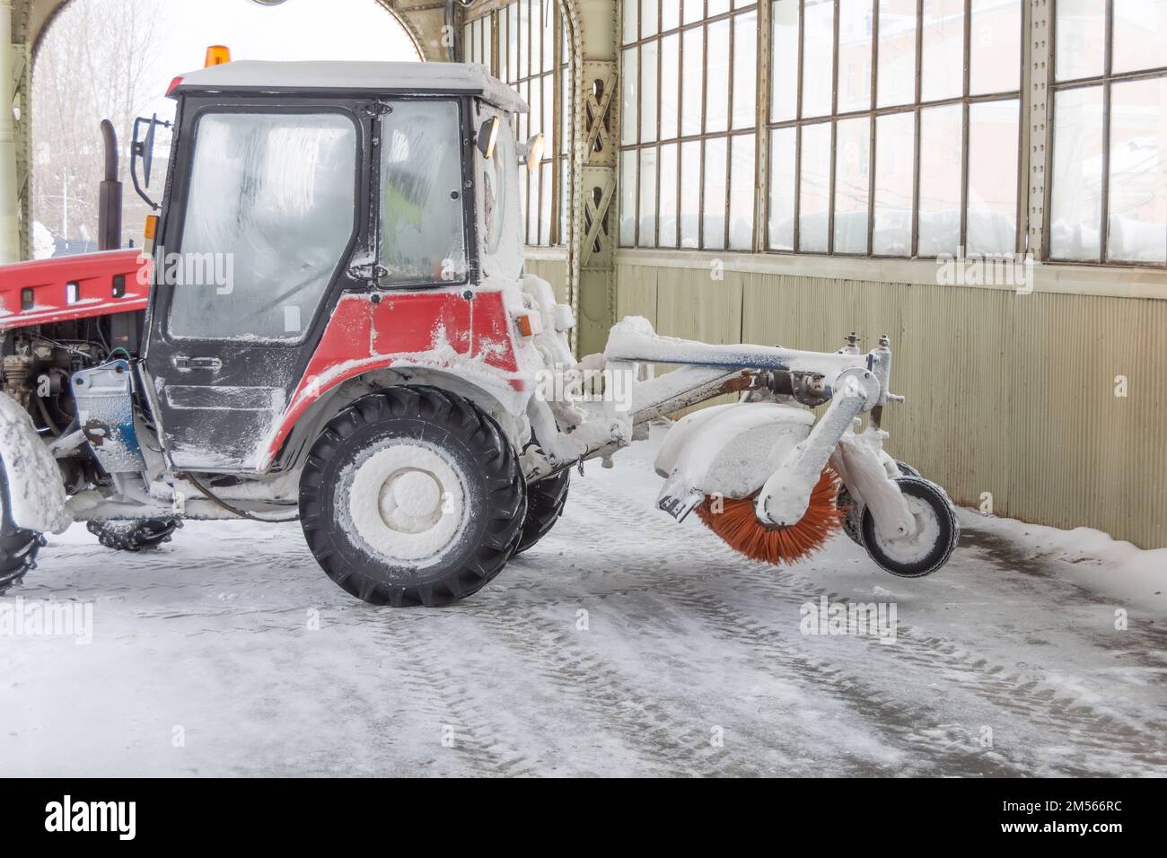 Tractor with rotating cleaning brush for sidewalks and on the rail ...