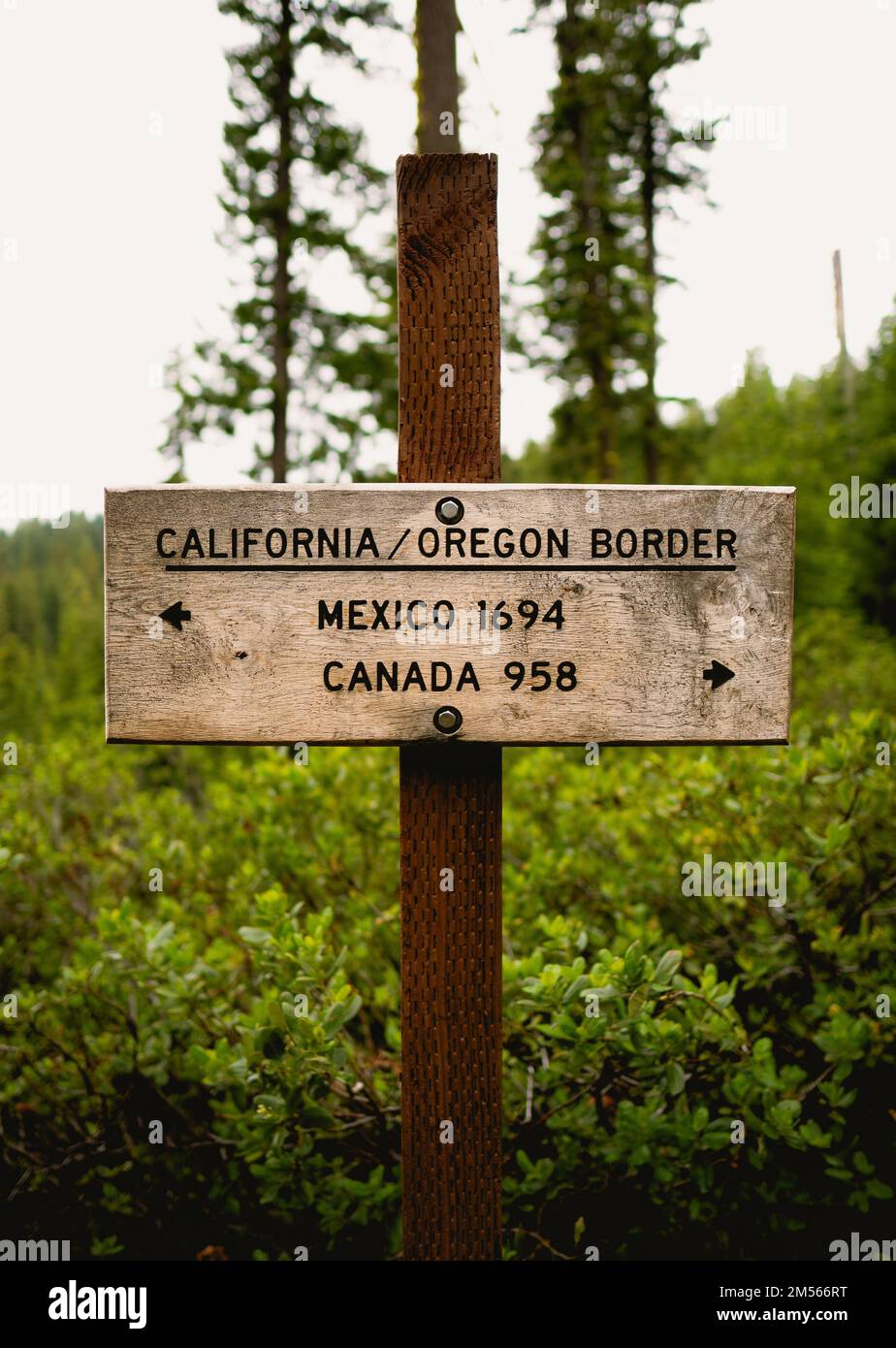 A vertical shot of the sign at the California-Oregon border and showing ...