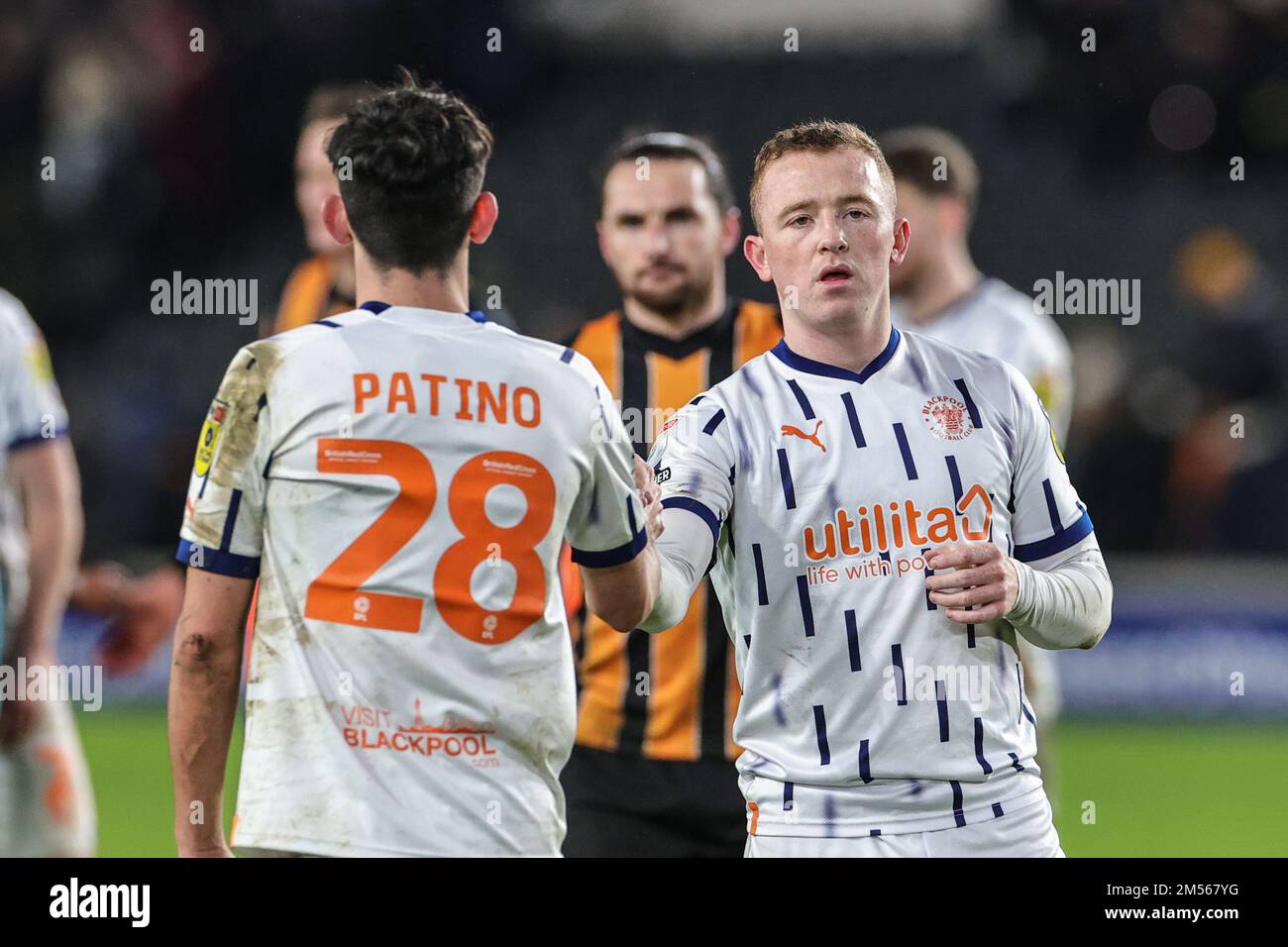 Shayne Lavery #19 of Blackpool shakes hands with Charlie Patino #28 of ...