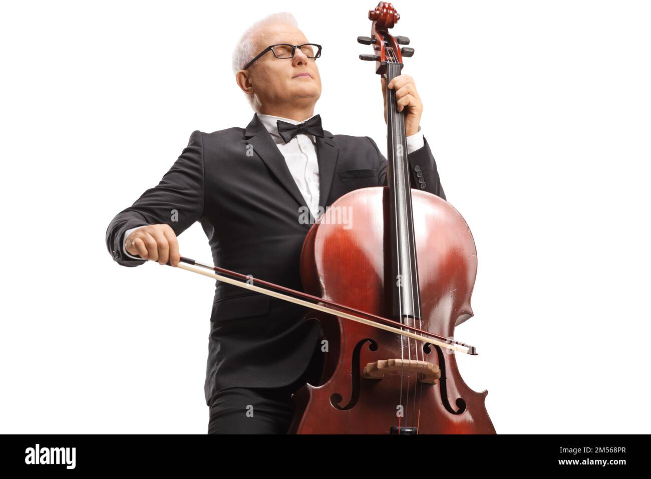 Mature man in a black suit playing a cello isolated on white background ...